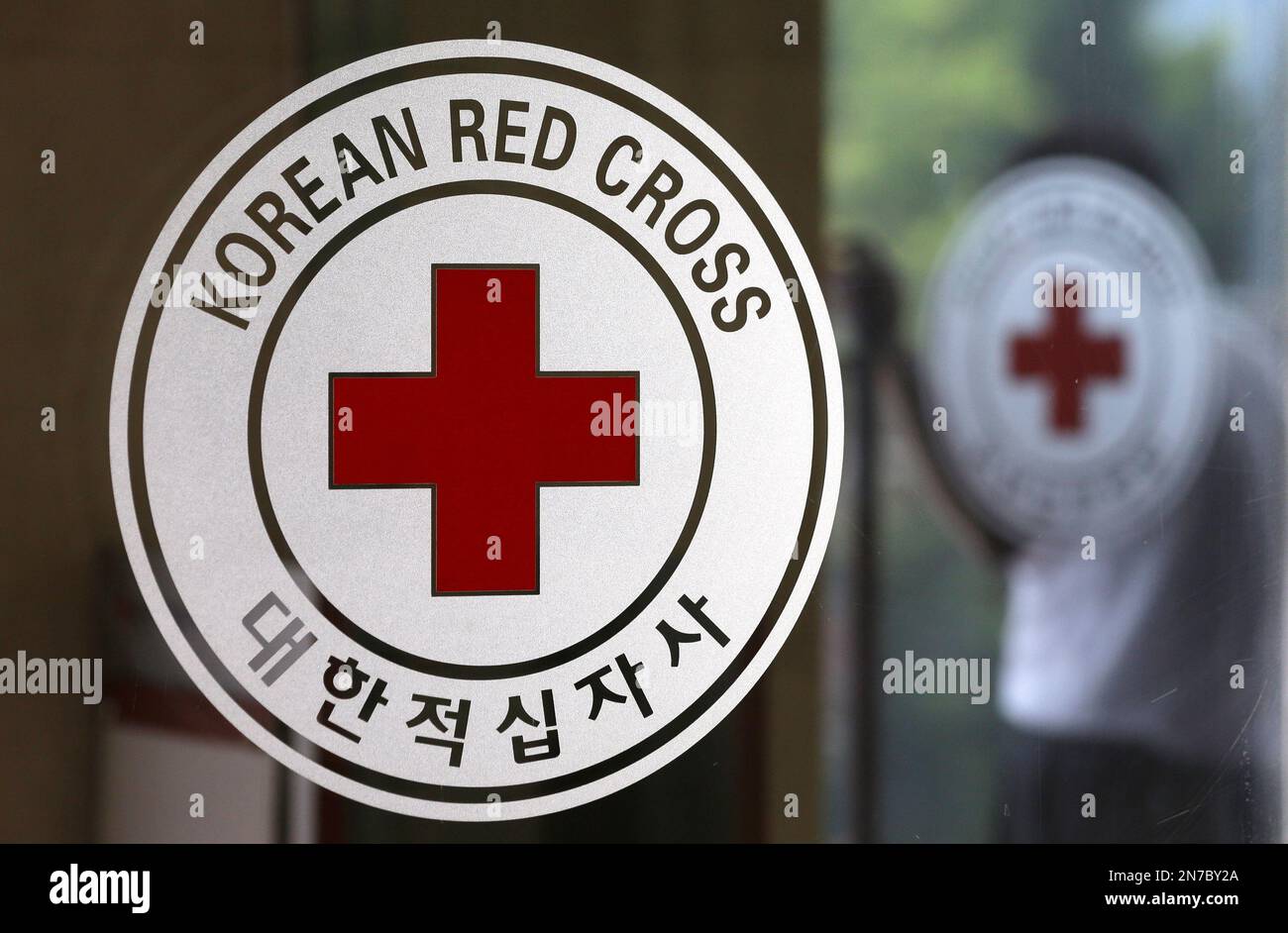 A man walks by an entrance way to the Korean Red Cross in Seoul, South ...