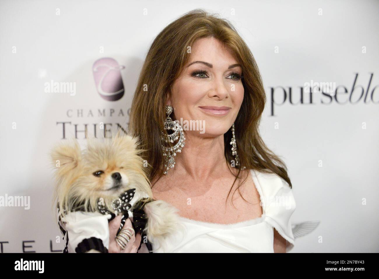 Lisa Vanderpump, with her dog Giggy arrives at the Beverly Hills ...