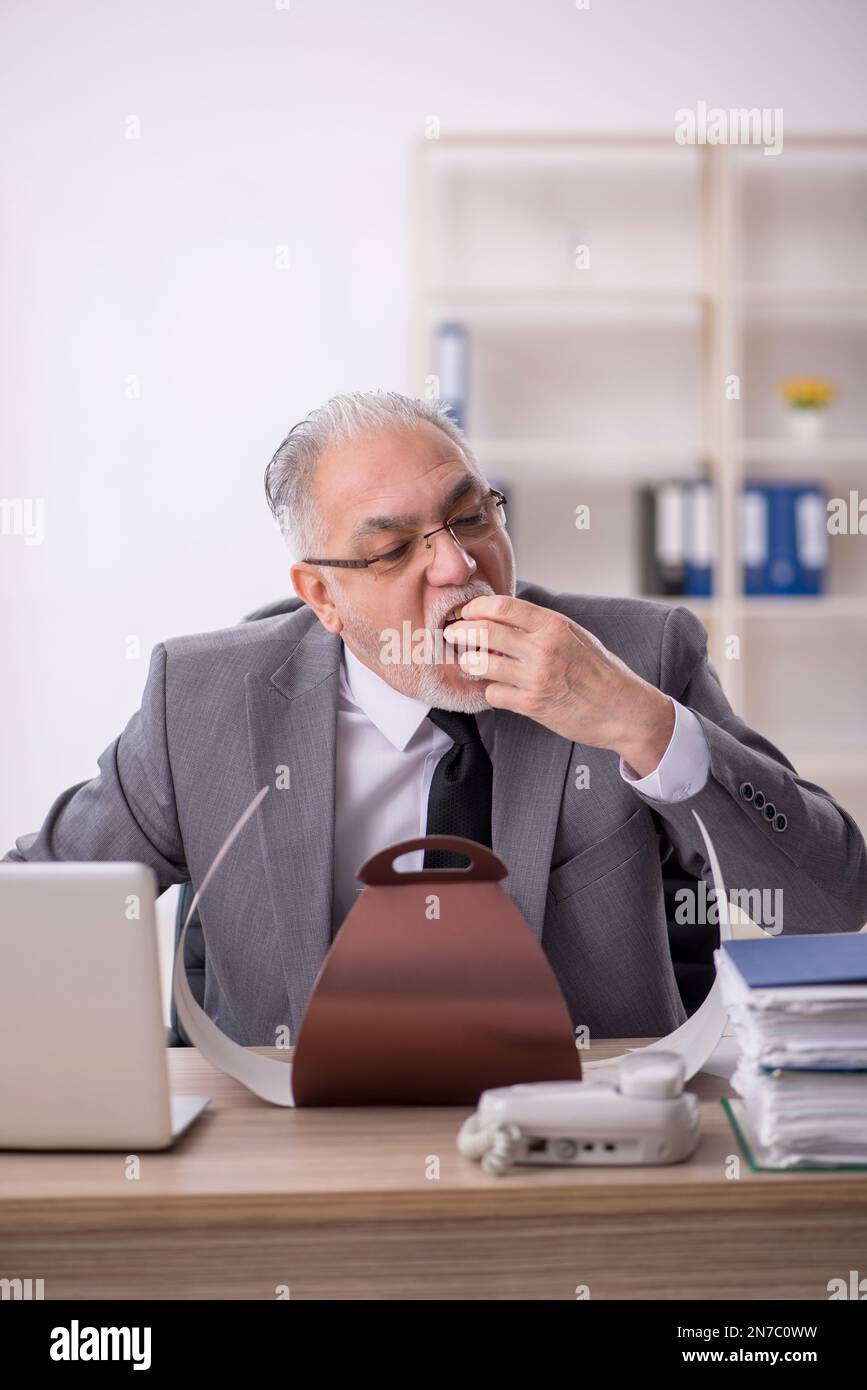 Happy businessman receiving birthday cake hi-res stock photography and ...