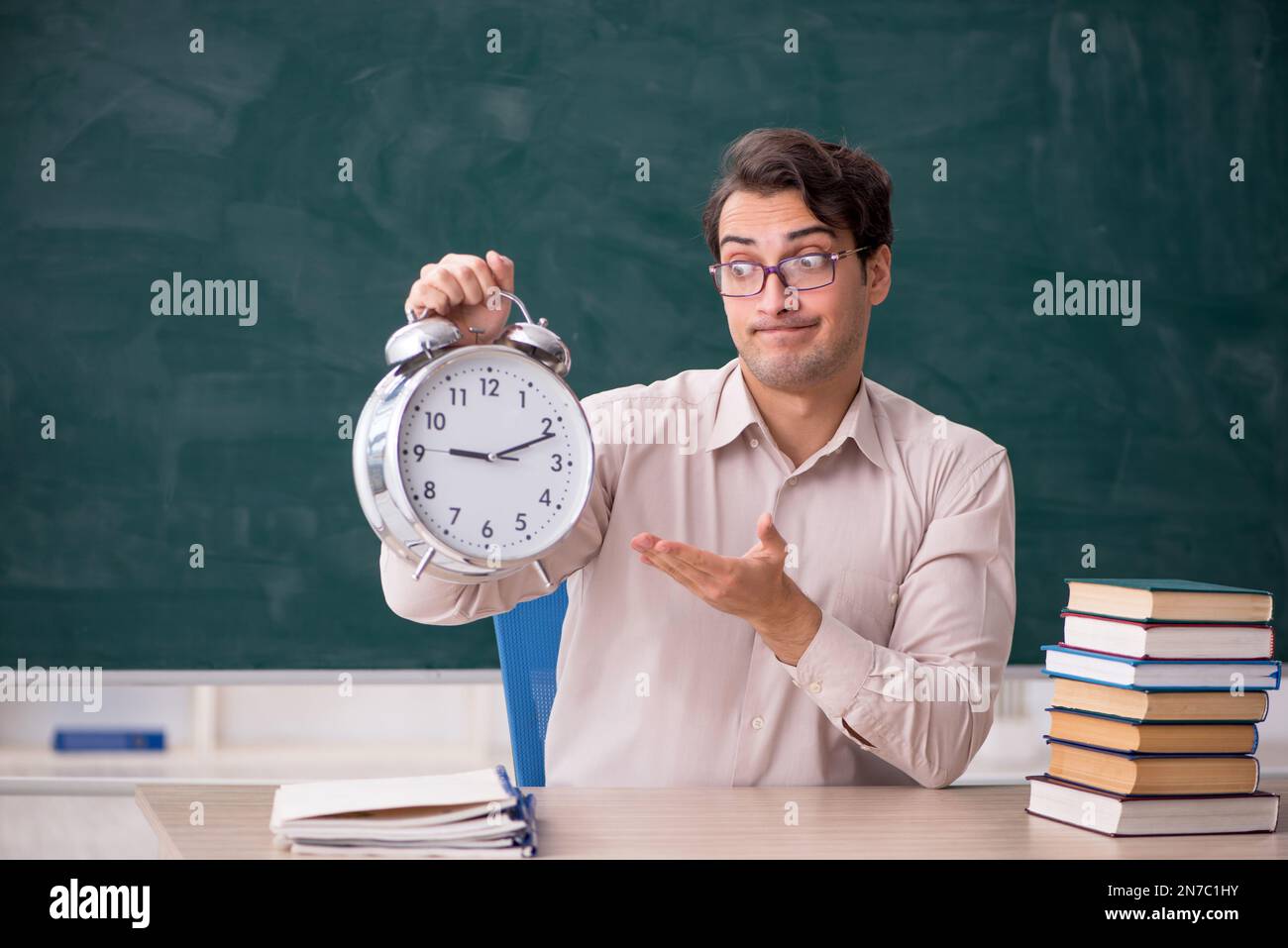 Young student in time management concept Stock Photo - Alamy