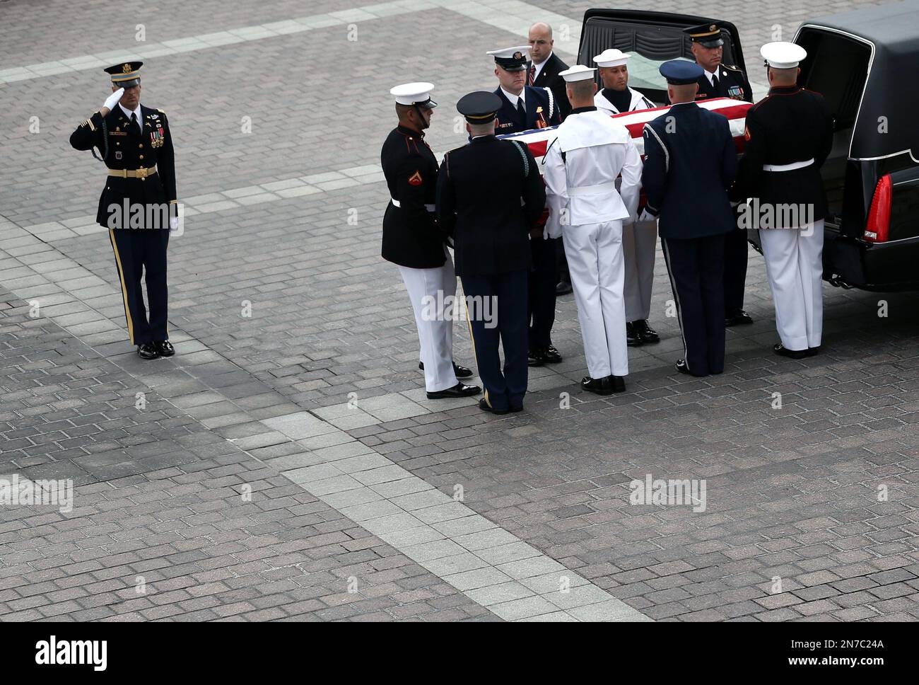 Members of a Army Forces Casket Team remove the casket of the late New ...