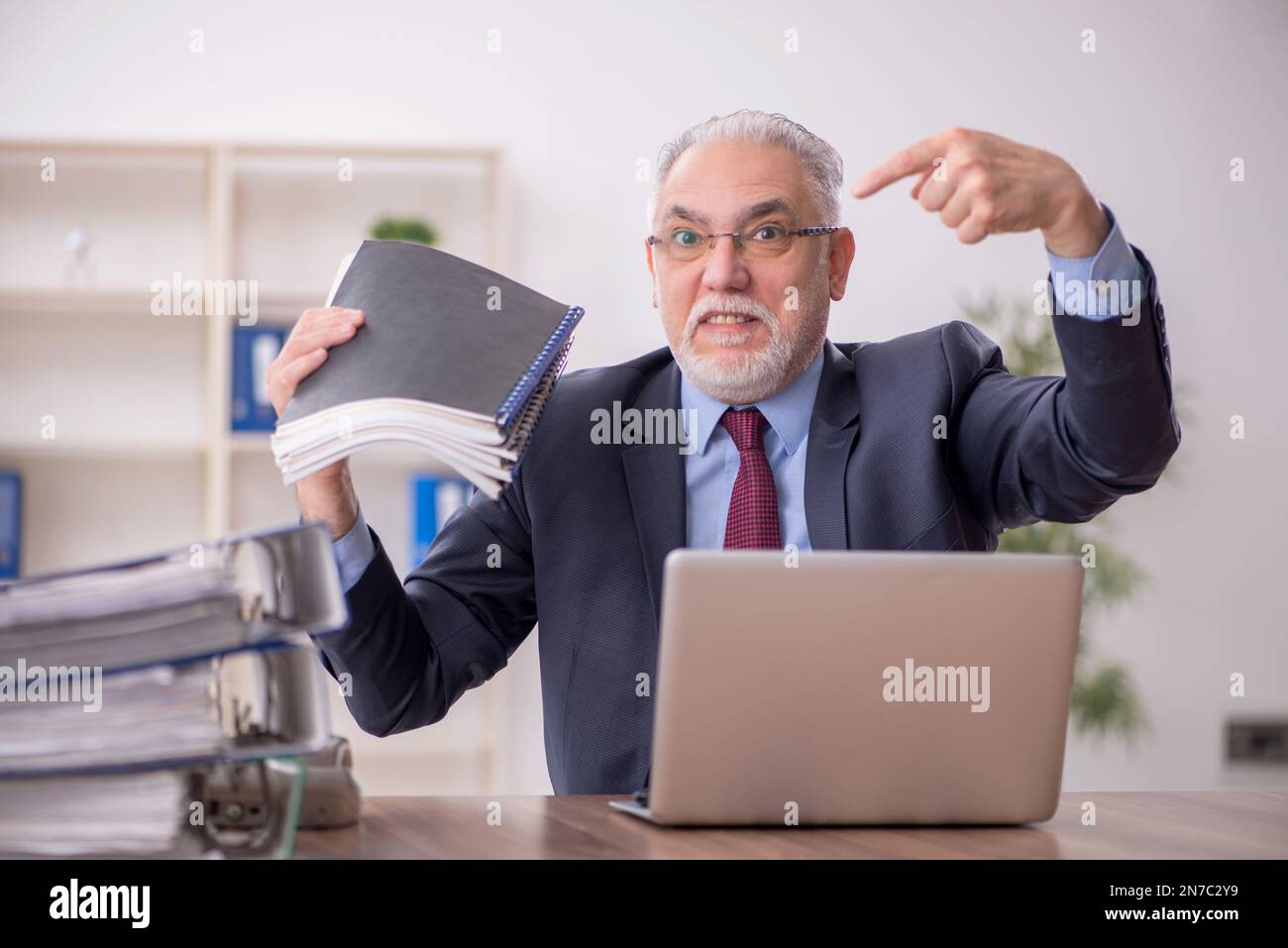 Old boss employee working at workplace Stock Photo - Alamy