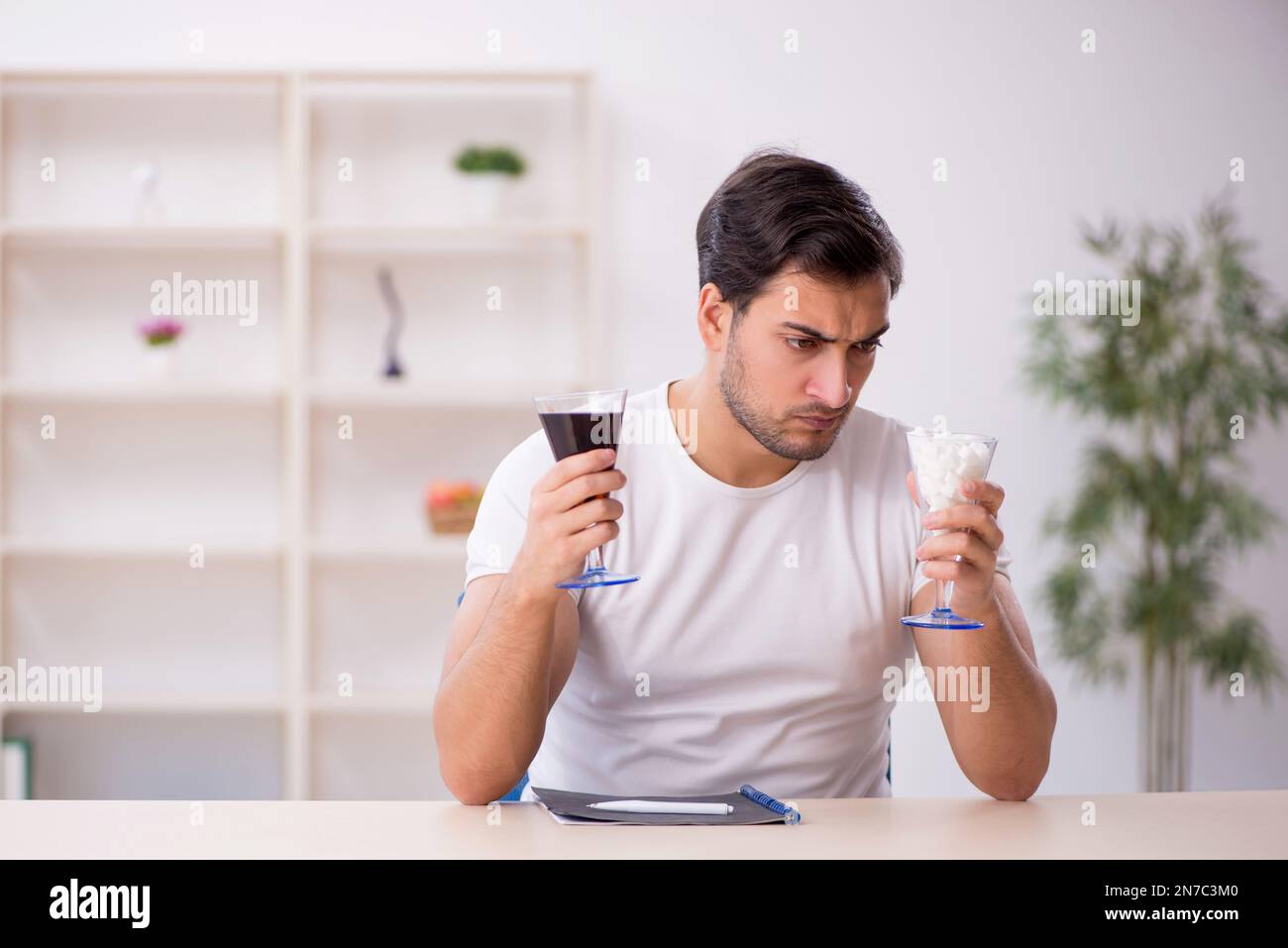 Young student testing soft drink Stock Photo - Alamy