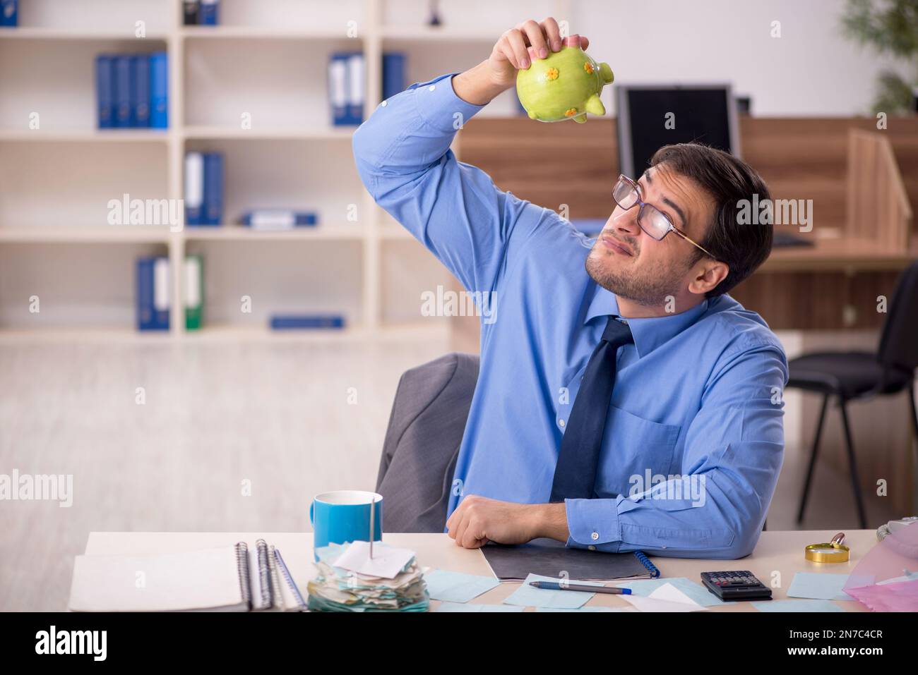 Young accountant working in the office Stock Photo - Alamy