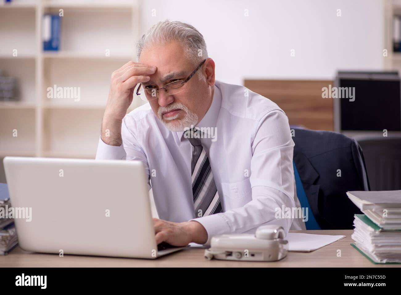 Focused busy old boss hi-res stock photography and images - Alamy