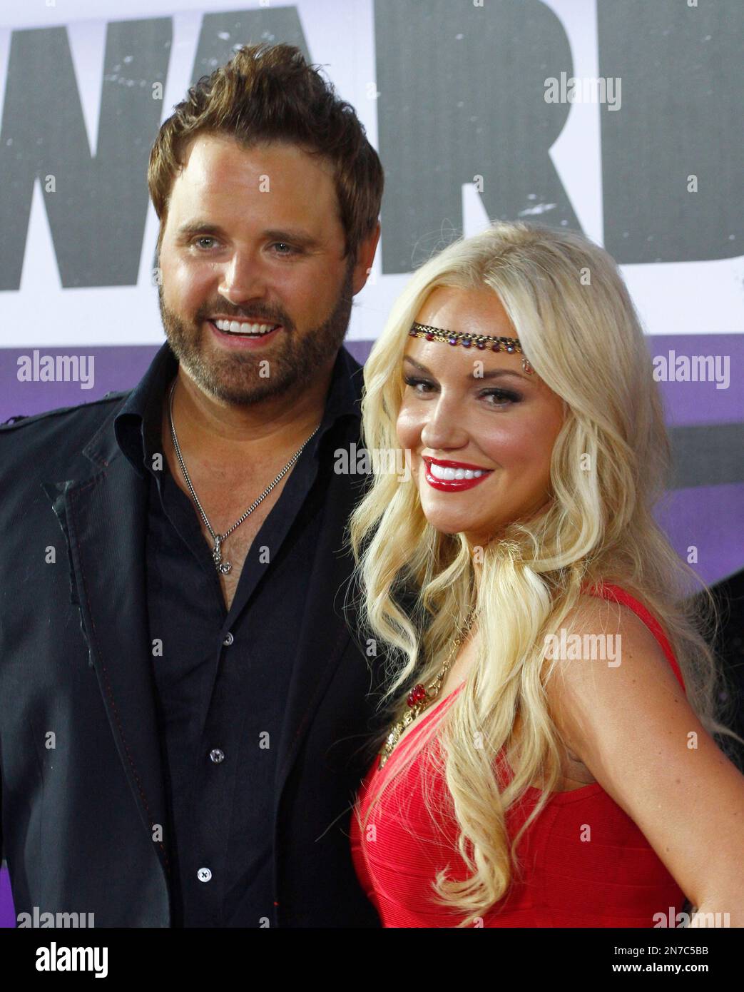 Randy Houser, left, and Jessa Lee Houser arrive at the 2013 CMT Music ...