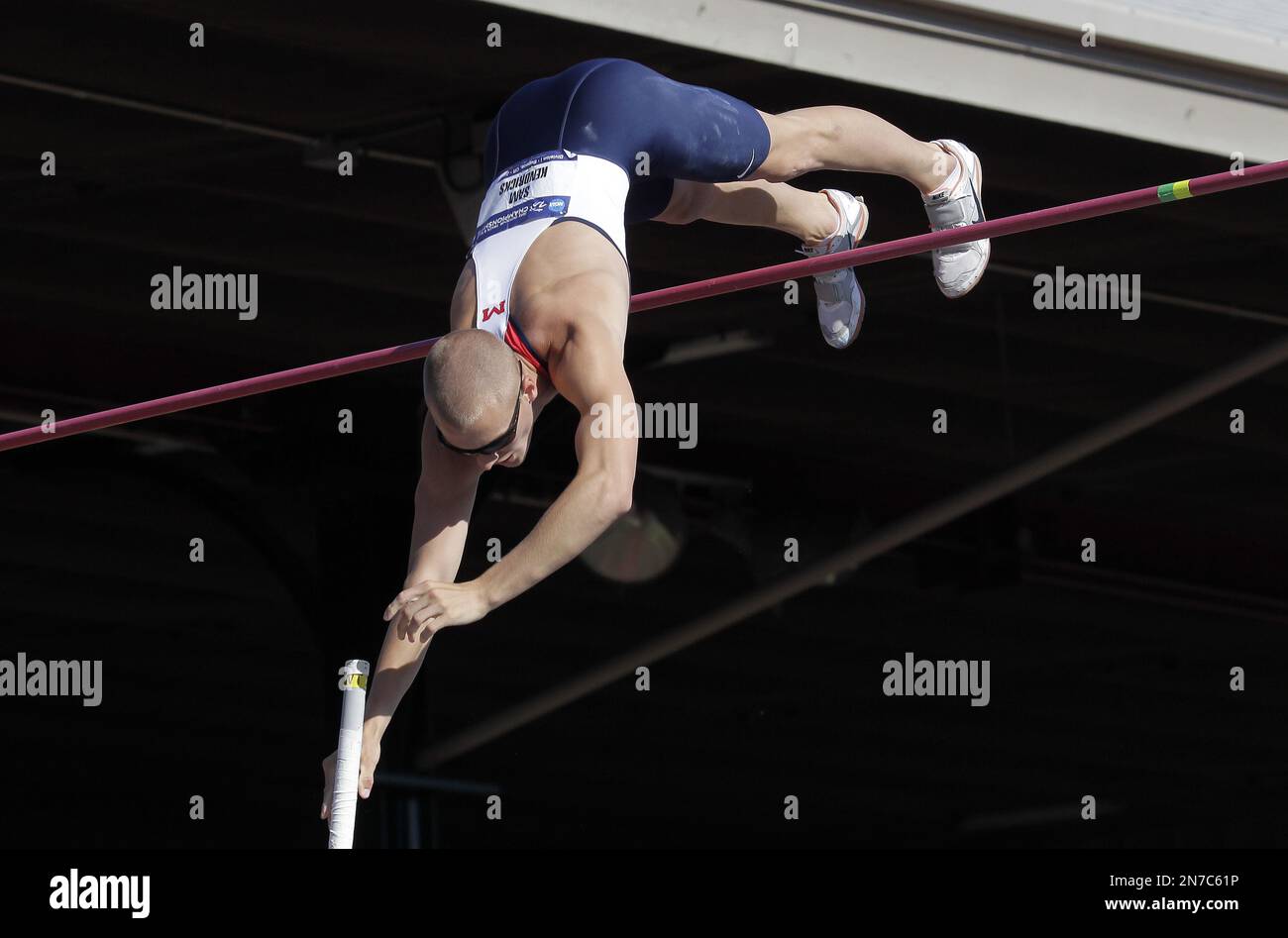 Mississippi' Sam Kendrick clears the bar on his way to winning the pole ...