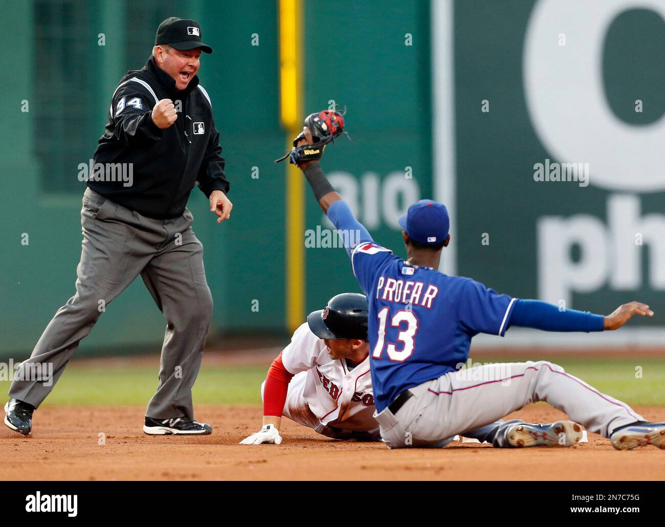 Second base umpire Sam Holbrook, left, calls the out on Boston Red Sox ...