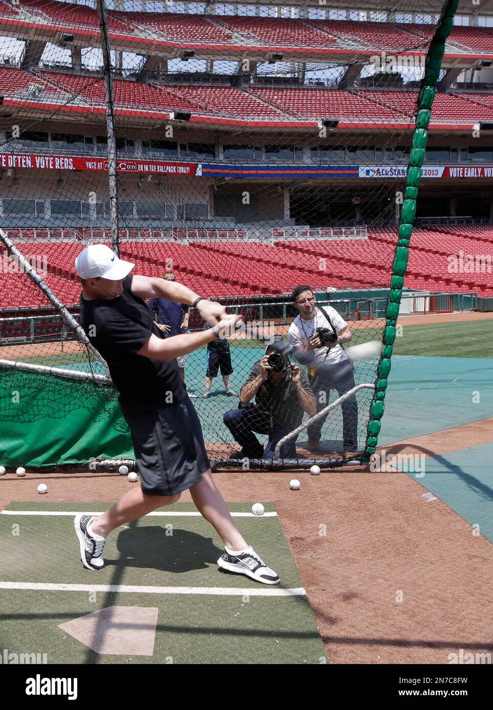 Cincinnati Bengals quarterback Andy Dalton hits in a batting cage as ...