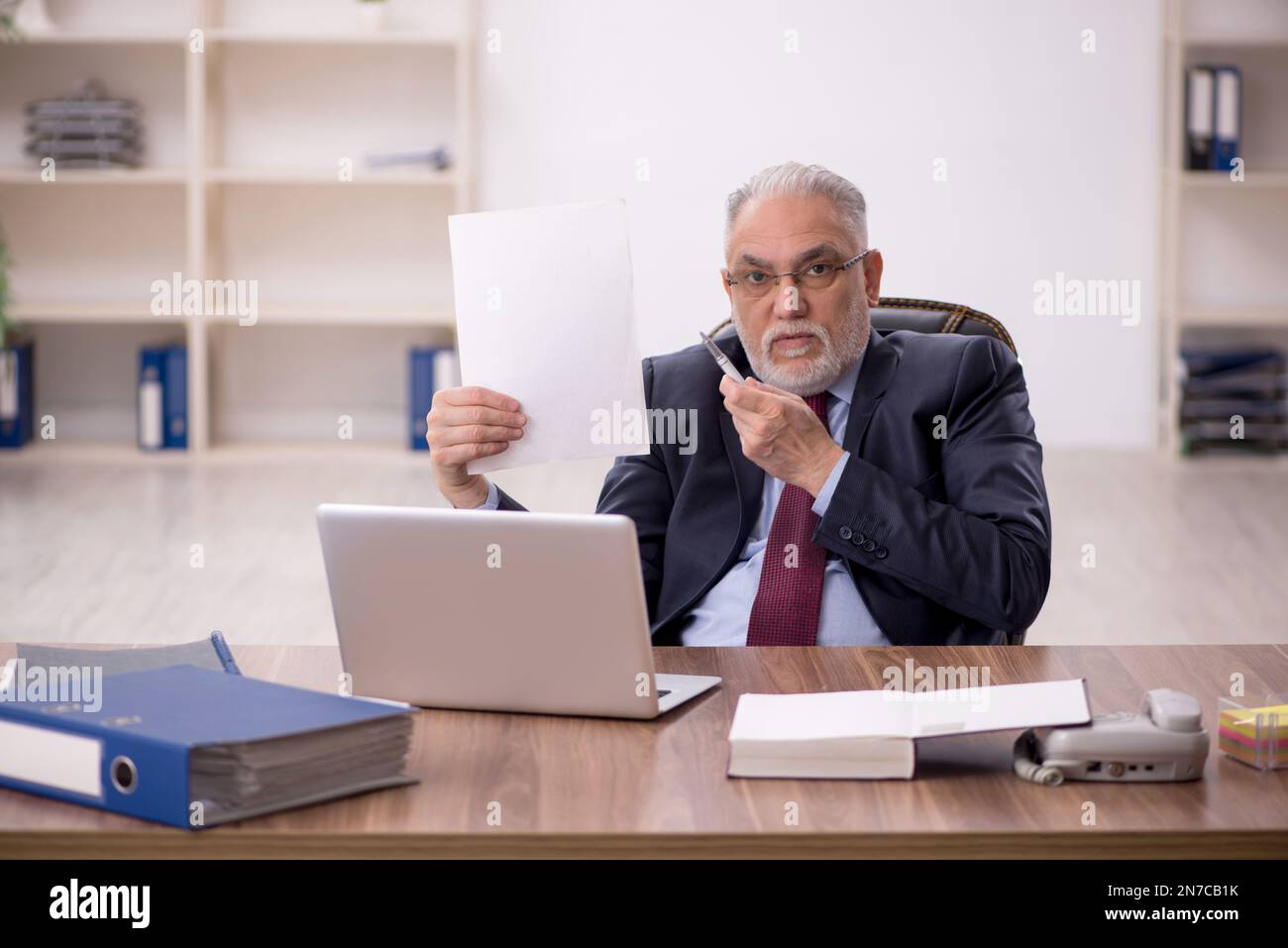 Old boss working in the office Stock Photo - Alamy