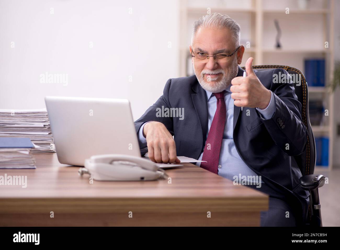 Old boss working in the office Stock Photo - Alamy