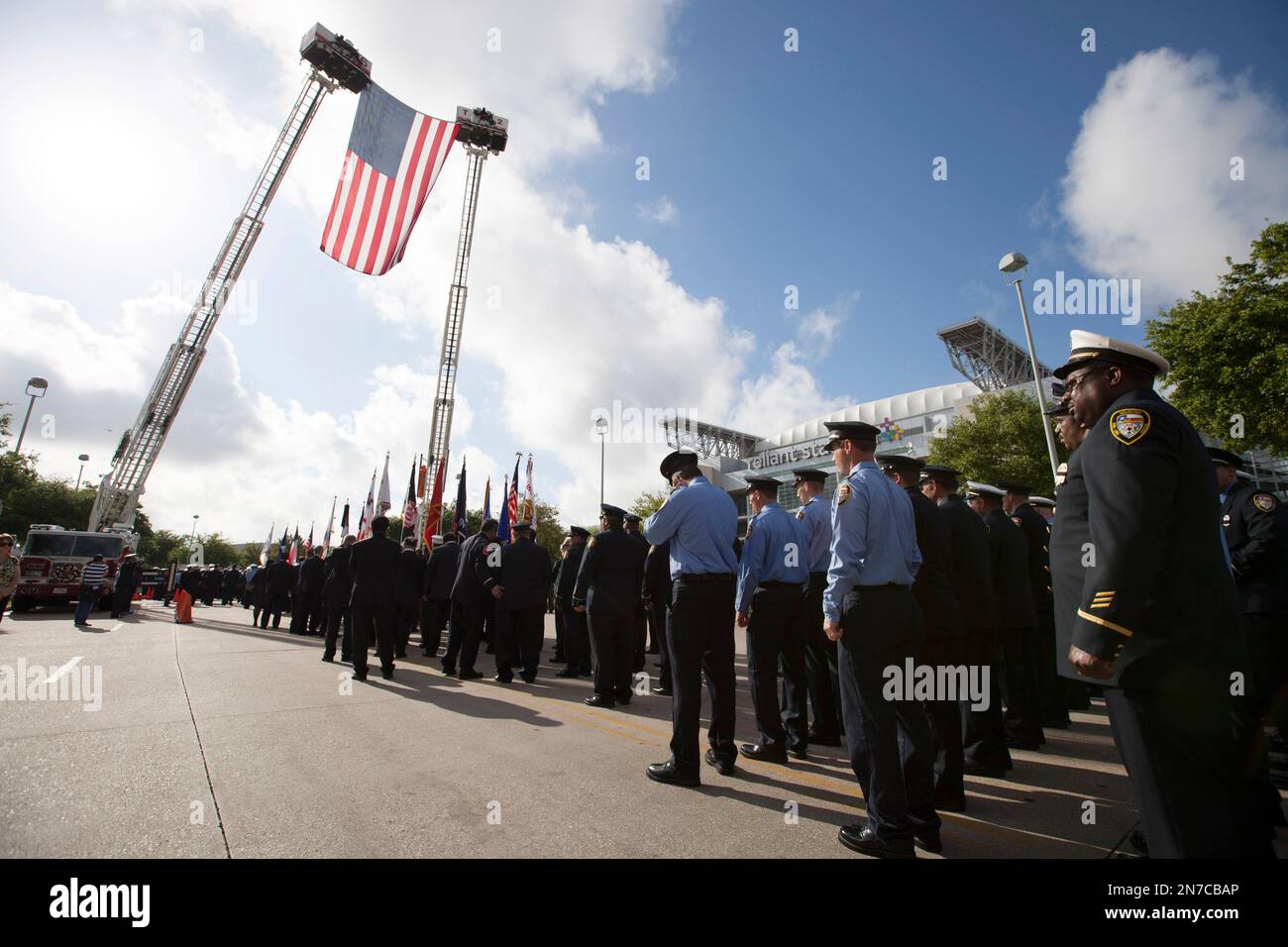 Firefighter's from around Houston and Texas walk during a firefighter's memorial procession ...