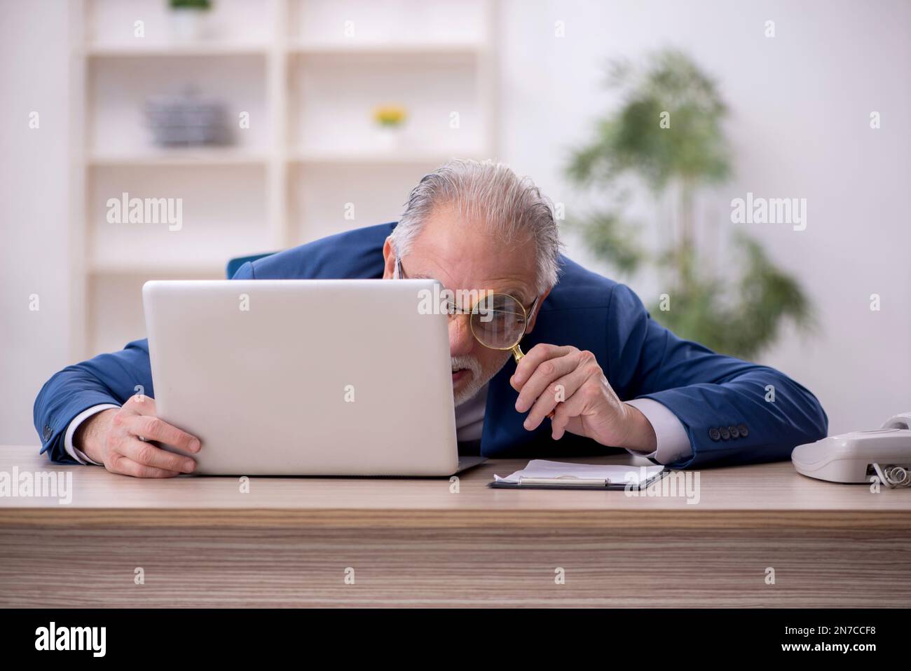 Old boss working in the office Stock Photo - Alamy