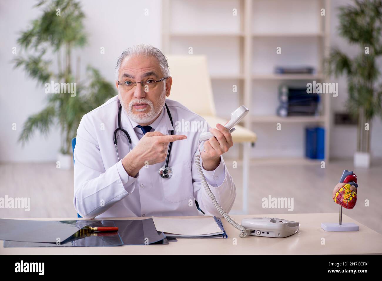 Old doctor radiologist working at the hospital Stock Photo - Alamy