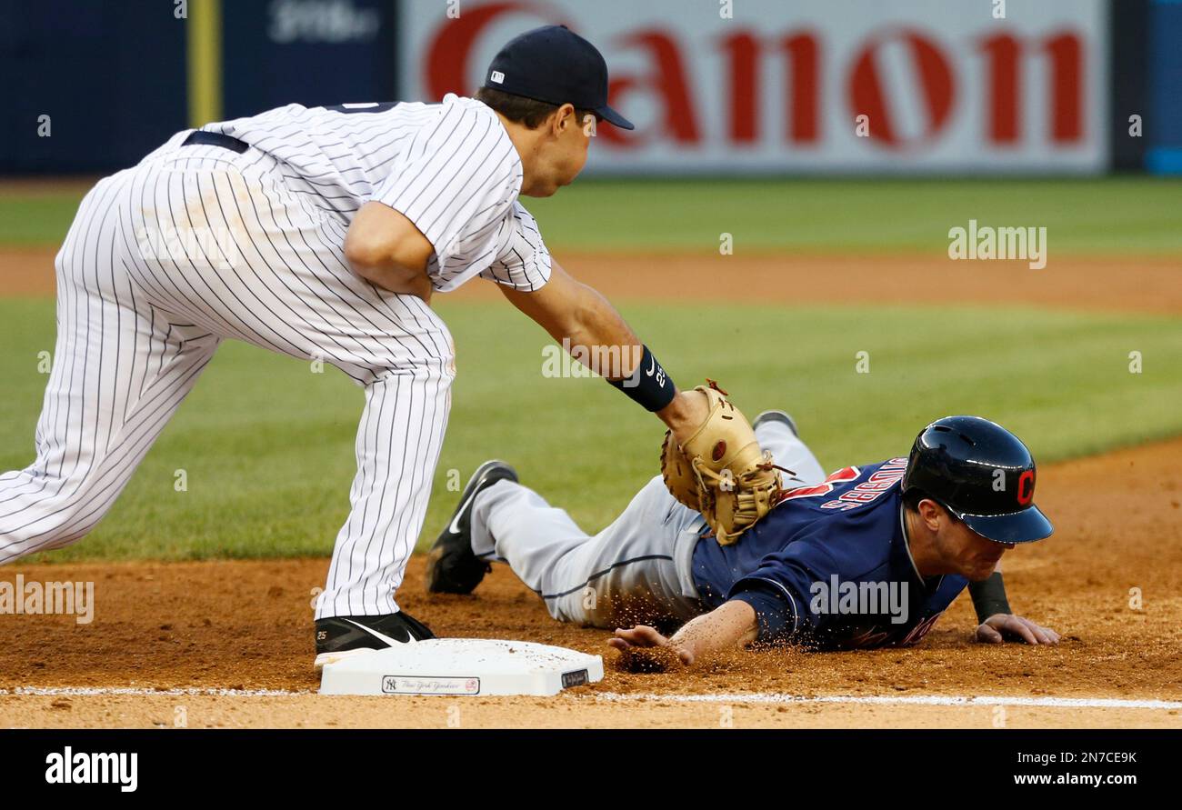 New York Yankees first baseman Mark Teixeira, left, appears to pick off ...