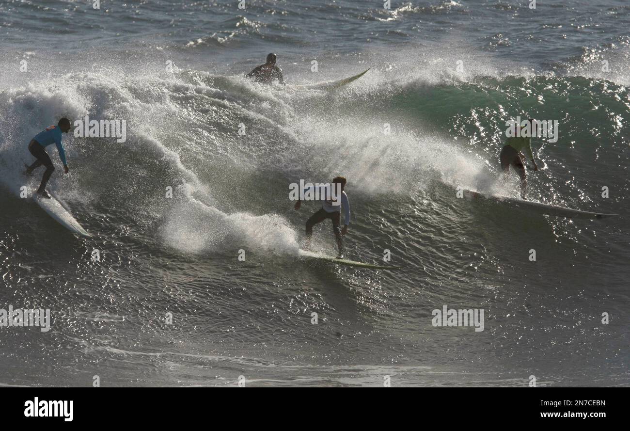 Surfers compete in the Ceremonial International Quiksilver Big Wave ...
