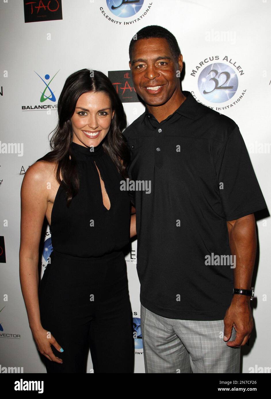Actress Taylor Cole and Marcus Allen pose at Marcus Allen Foundation ...