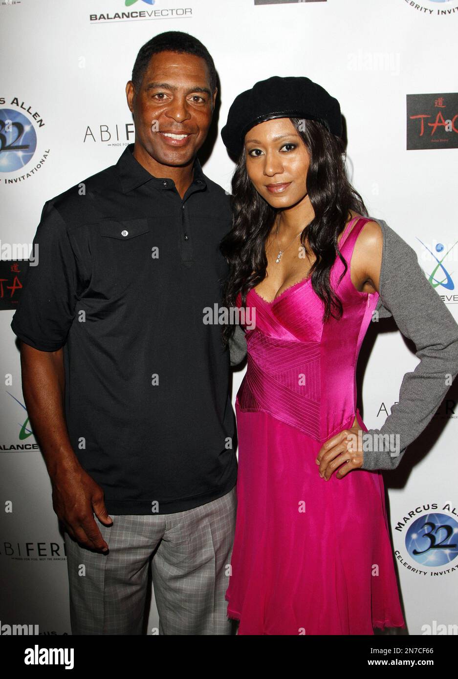 Marcus Allen and recording artist Vaja pose at Marcus Allen Foundation ...