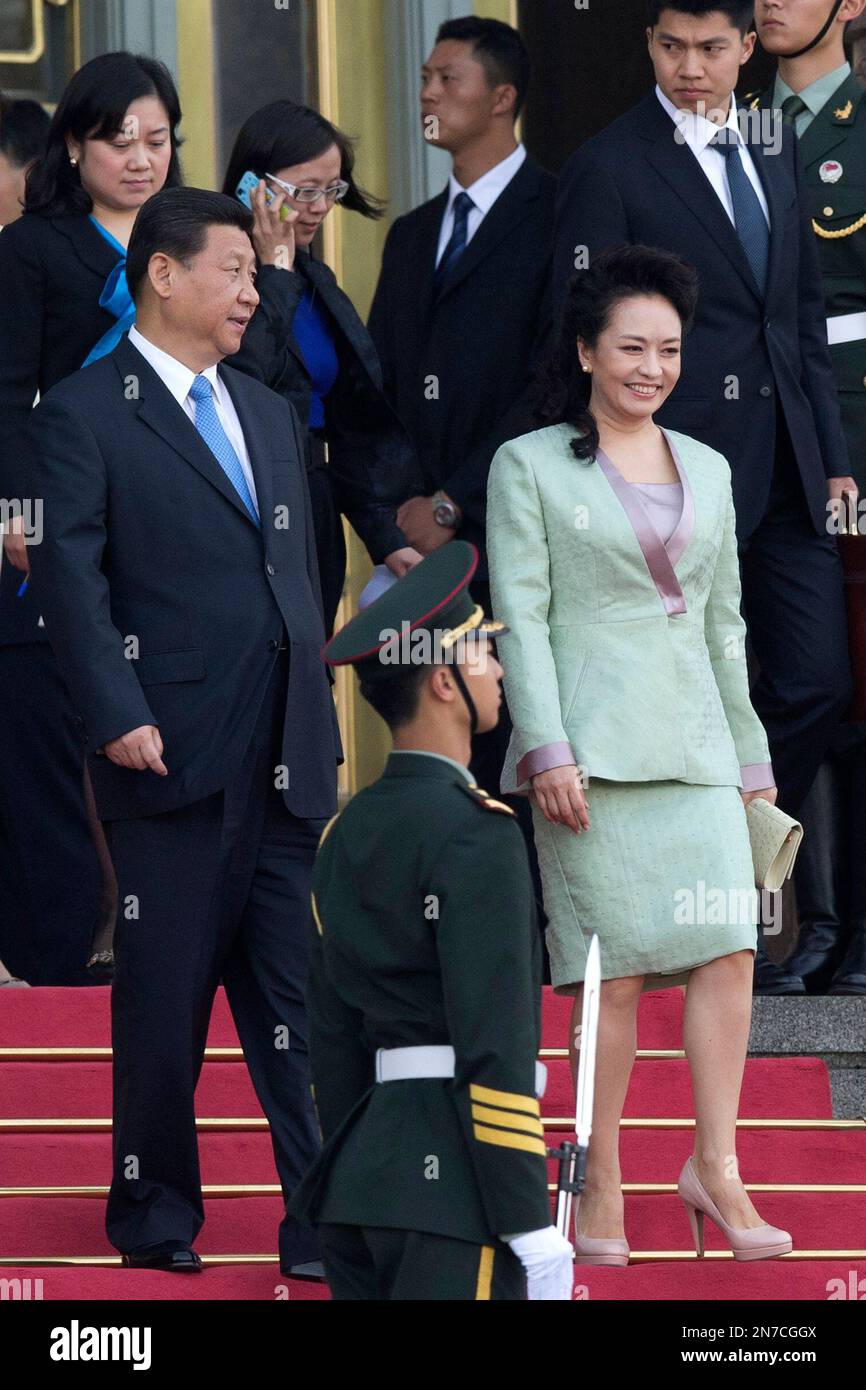 Chinese first lady Peng Liyuan, right, and Chinese President Xi Jinping ...