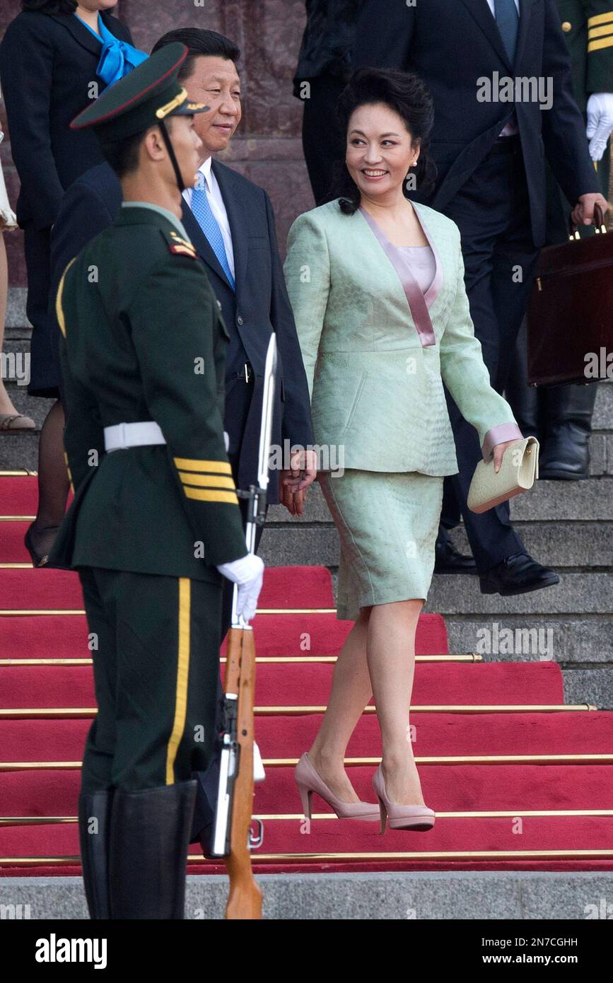 Chinese first lady Peng Liyuan, right, and Chinese President Xi Jinping ...