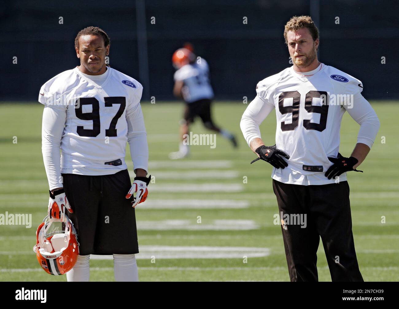 Cleveland Browns linebackers Jabaal Sheard (97) and Paul Kruger watch ...