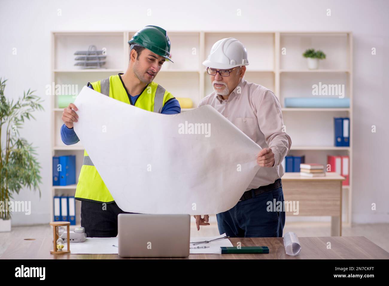 Two architects working on the project Stock Photo - Alamy