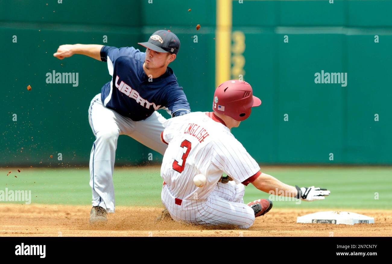 Liberty's shortstop Dalton Britt cannot handle the throw as South ...