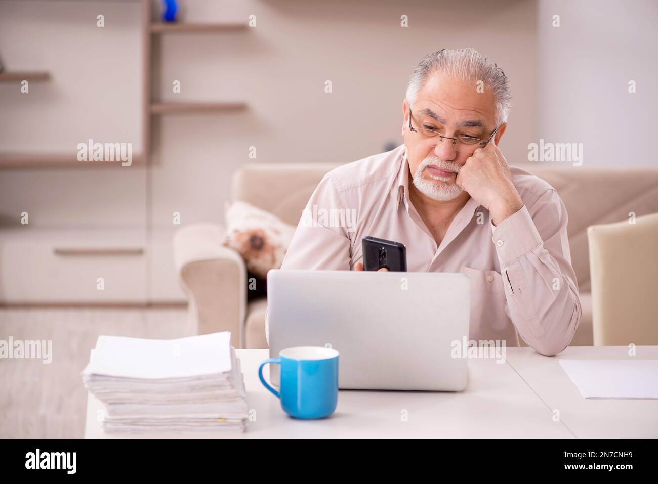 Old boss employee working from home during pandemic Stock Photo - Alamy