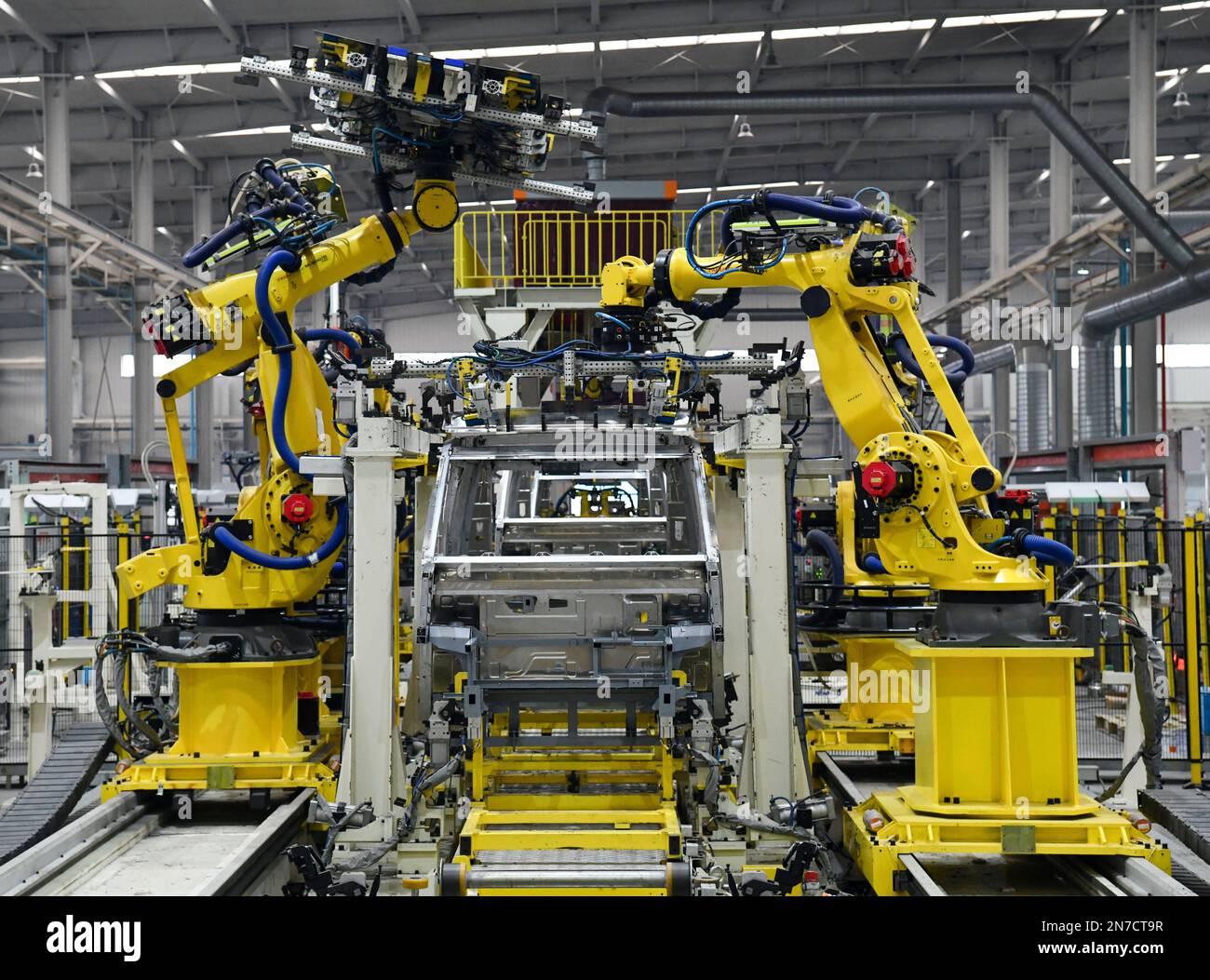 ZOUPING, CHINA - FEBRUARY 9, 2023 - A robot rivets an all-aluminum ...