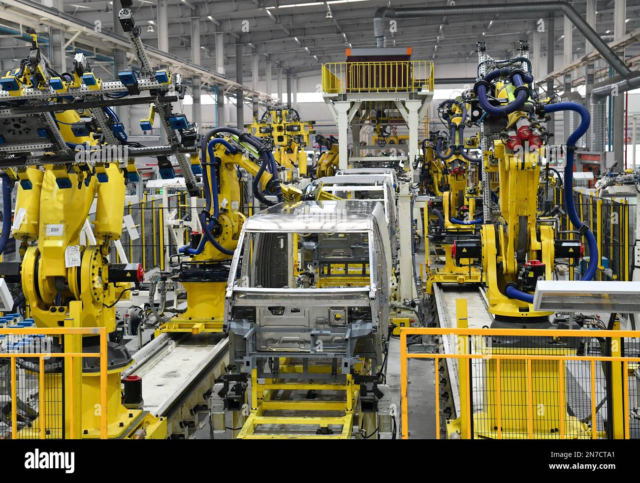 ZOUPING, CHINA - FEBRUARY 9, 2023 - A robot rivets an all-aluminum ...