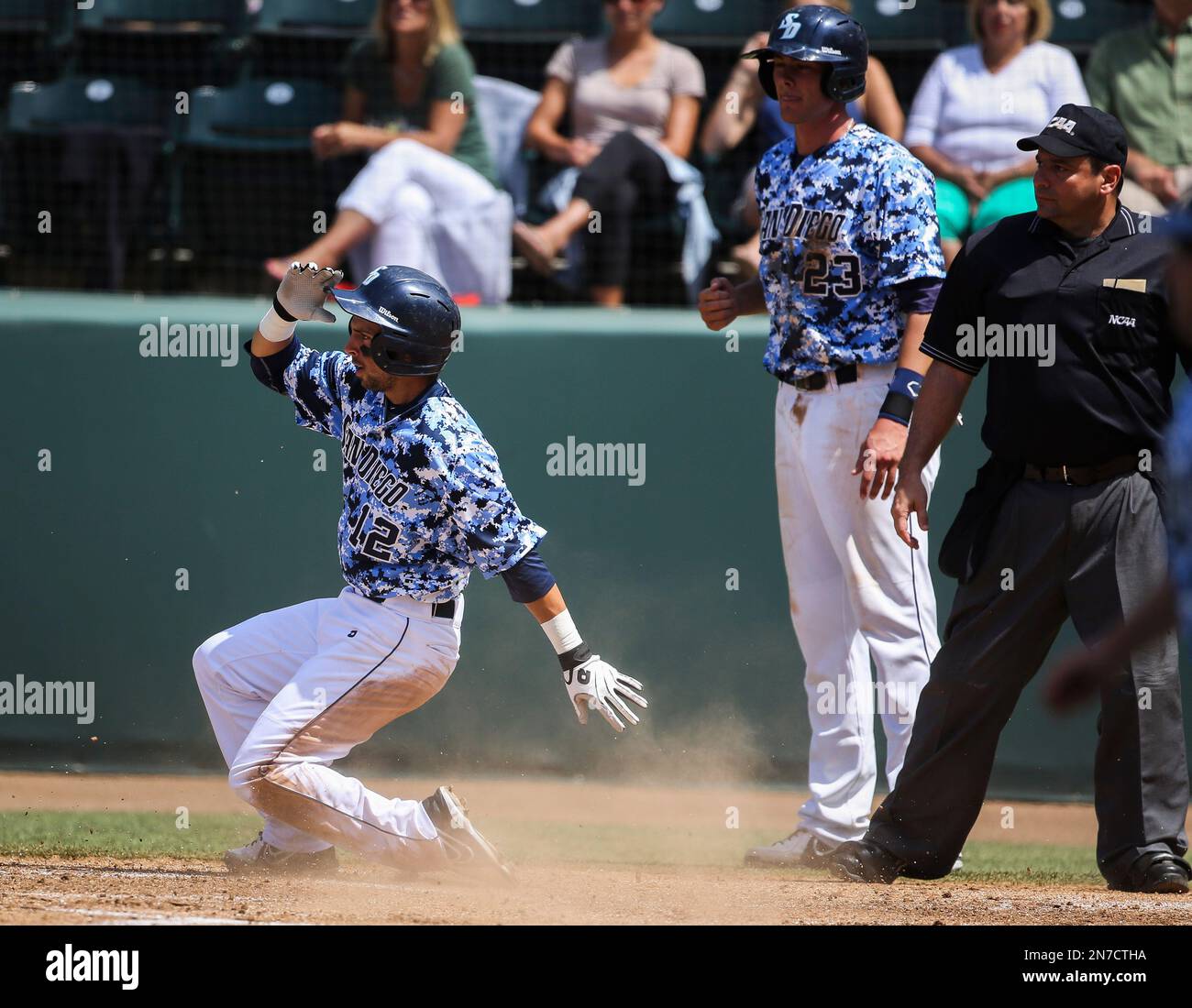 San Diego's Austin Bailey (12) and Kris Bryant score during the third ...