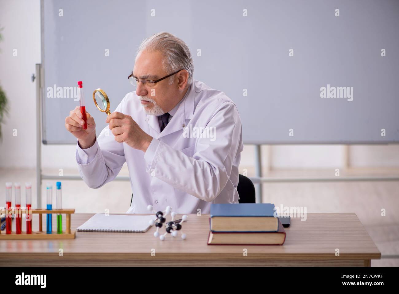 Old chemistry teacher in the classroom Stock Photo - Alamy