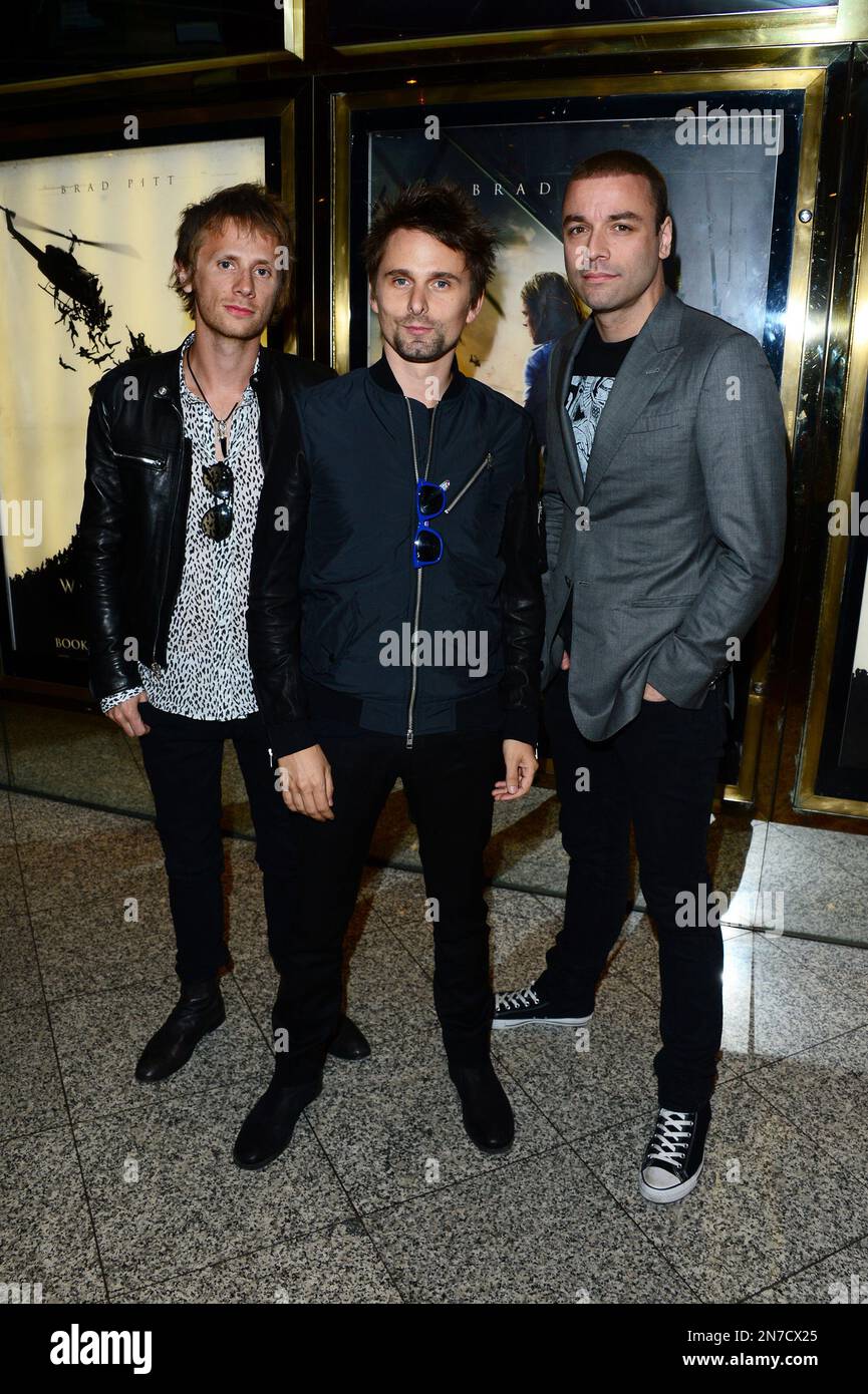 Muse members Matthew Bellamy, Christopher Wolstenholme and Dominic ...