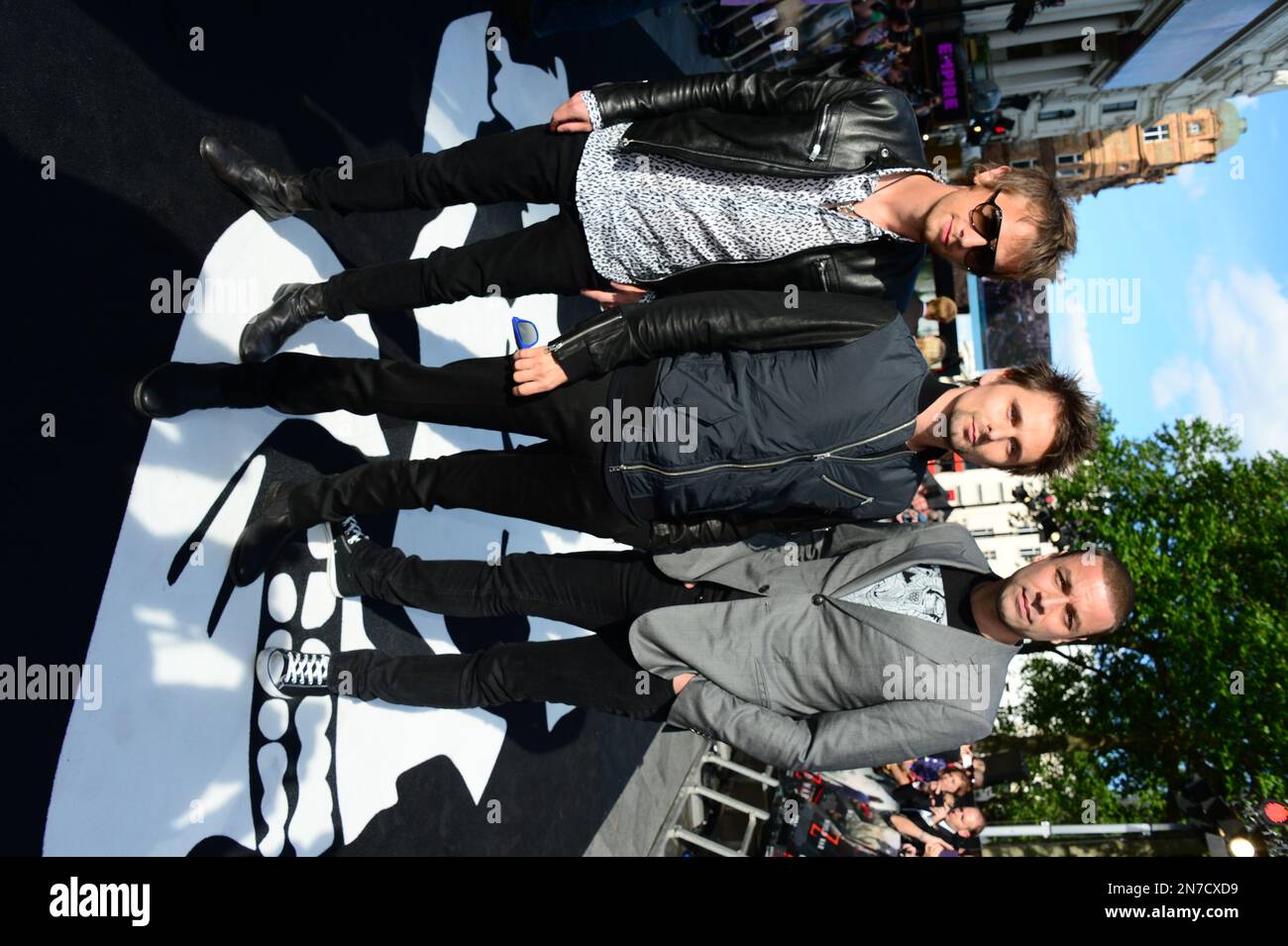 Muse members Matthew Bellamy, Christopher Wolstenholme and Dominic ...