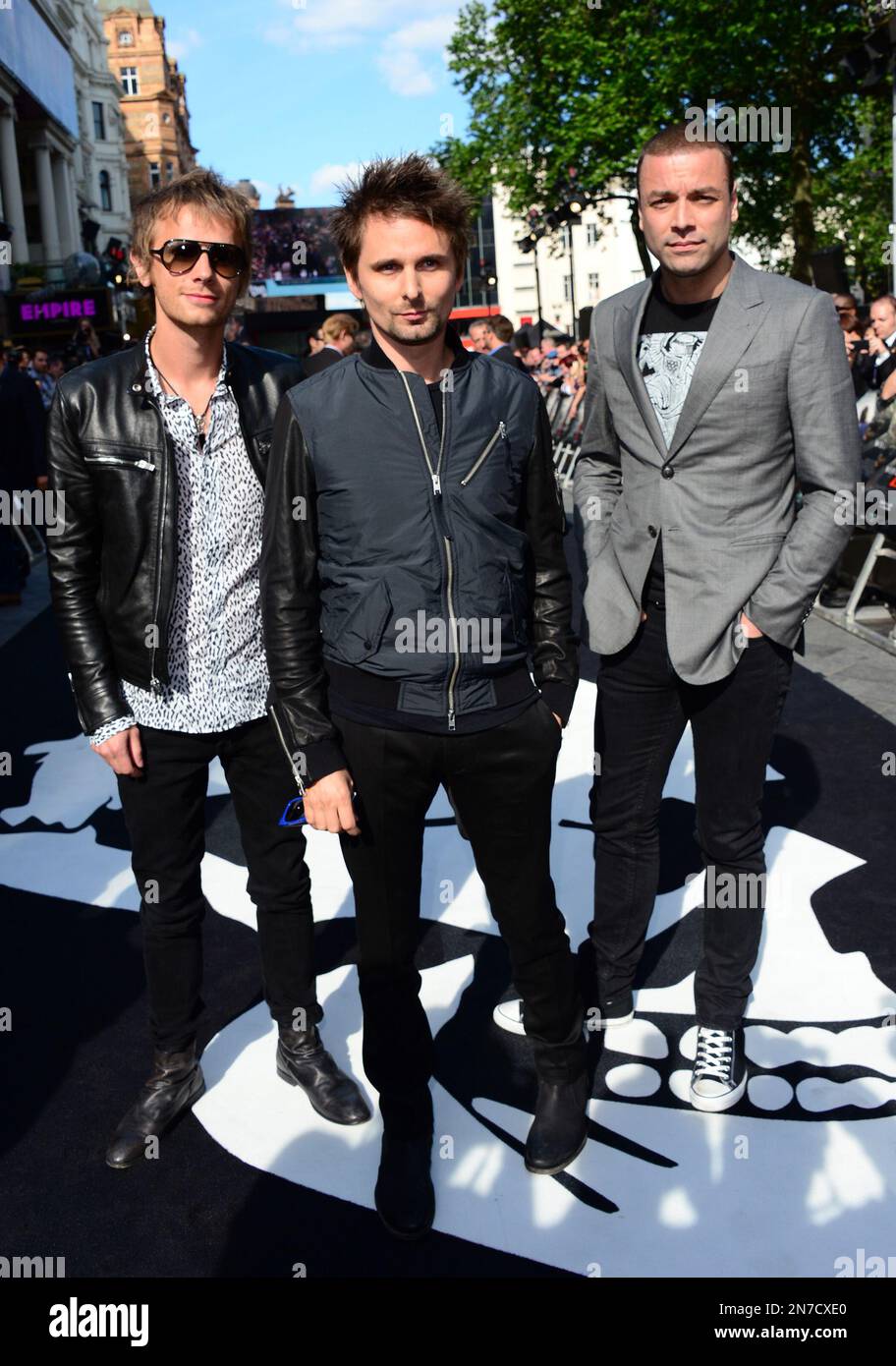 Muse members Matthew Bellamy, Christopher Wolstenholme and Dominic ...