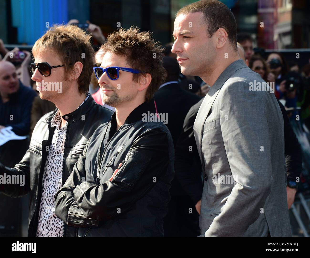Muse members Matthew Bellamy, Christopher Wolstenholme and Dominic ...