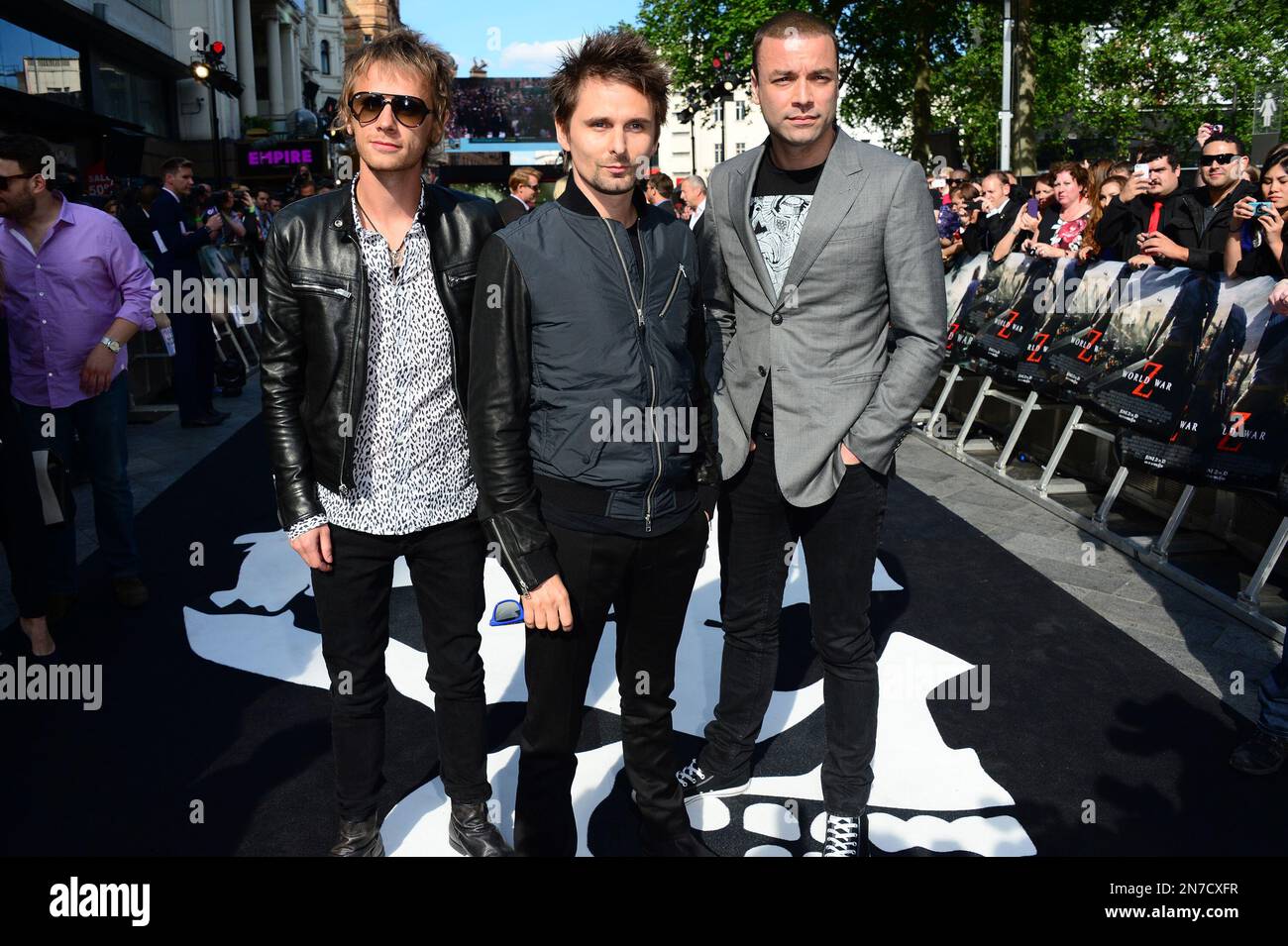 Muse members Matthew Bellamy, Christopher Wolstenholme and Dominic ...