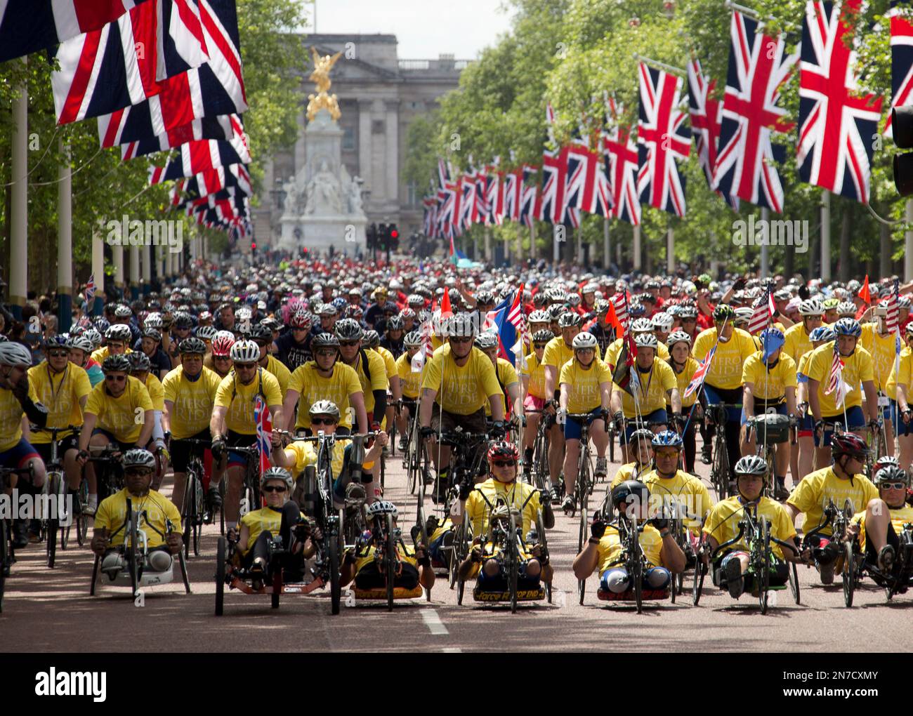 Hundreds of cyclists cycle the final stretch along the Mall, in central ...