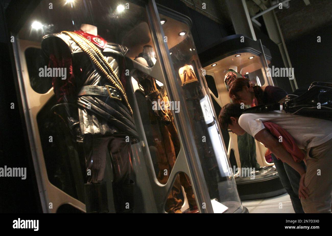 Fans look around exhibits at the "Star Trek: The Exhibition," a ...