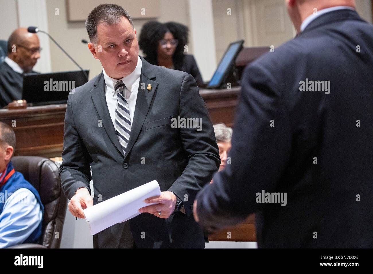 FBI special agent Matthew Wilde, front left, is questioned by ...