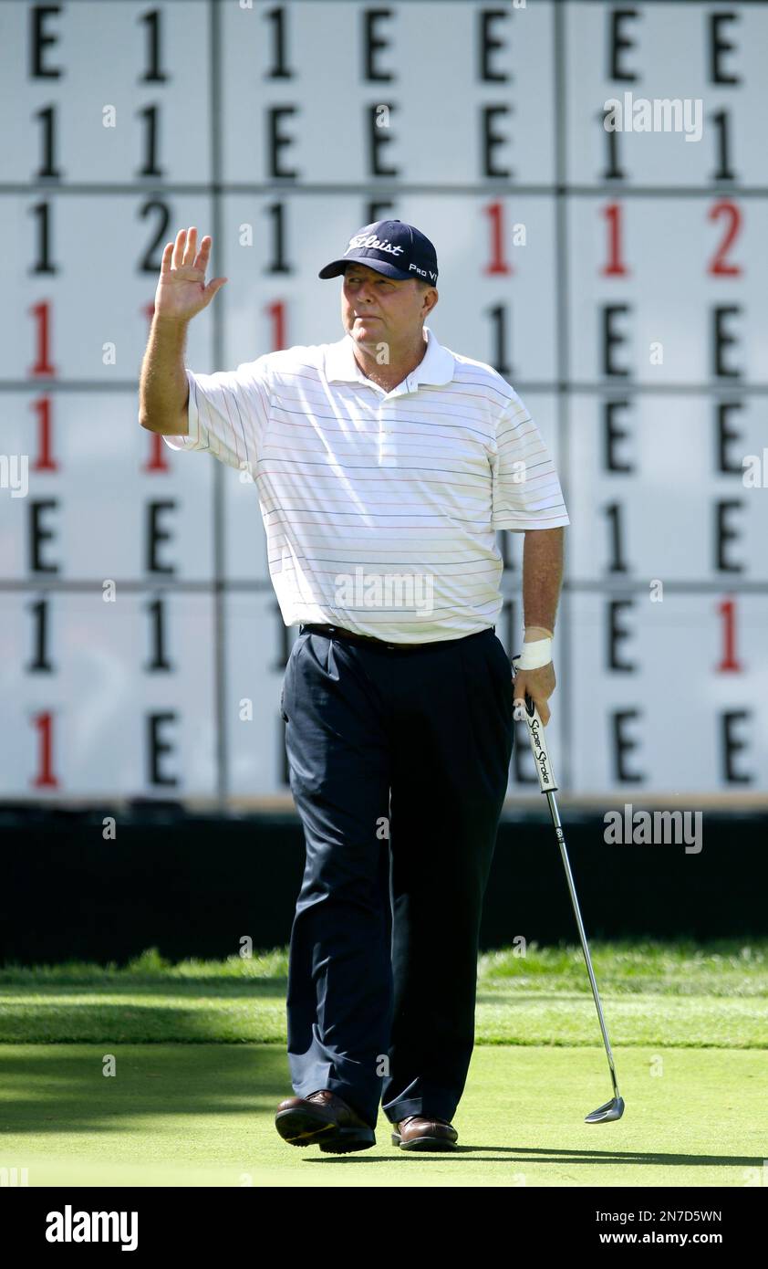 Scott Hoch reacts after making a birdie putt on the 18th green during ...