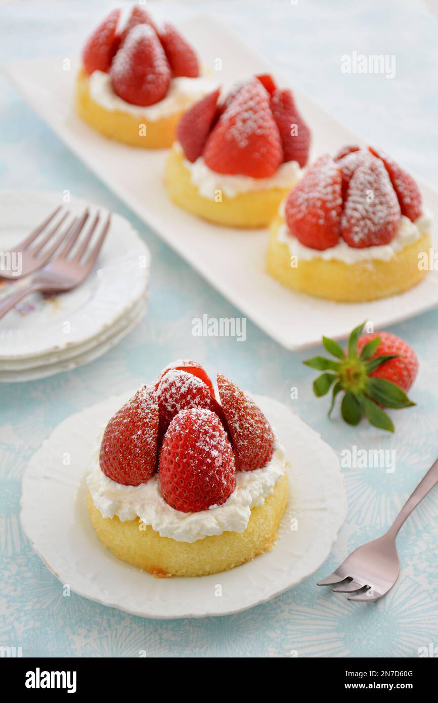 Fresh sweet strawberries with whipped cream on yellow sponge dessert ...