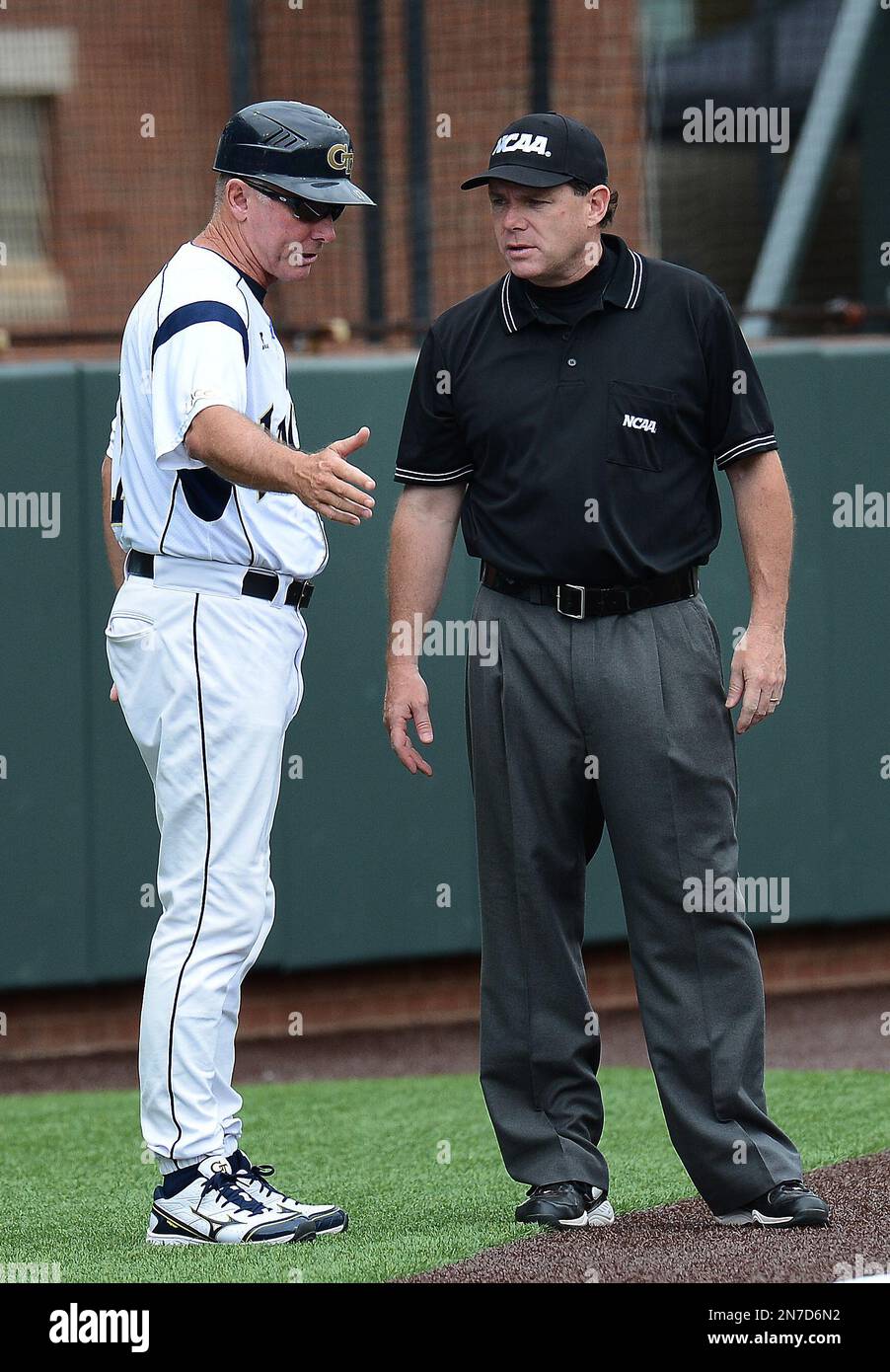 Georgia Tech head coach Danny Hall argues with third base umpire Tim ...