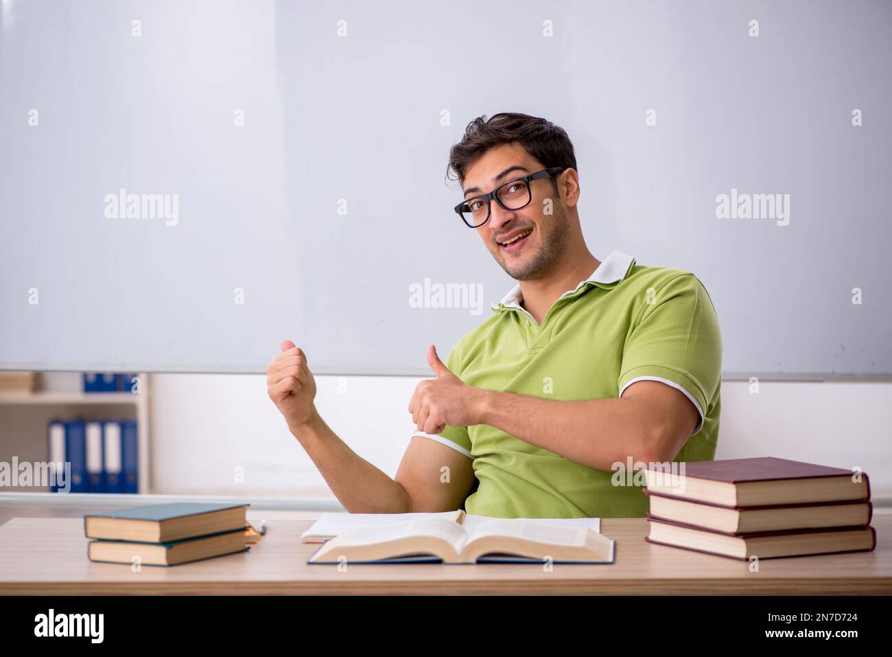 Young student sitting in the classroom in front of whiteboard Stock ...