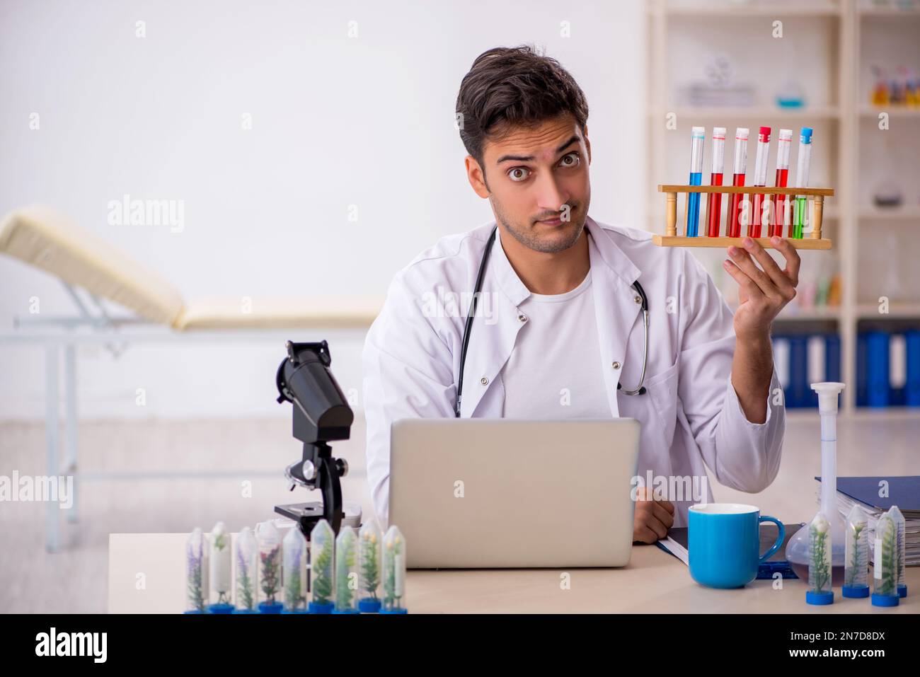 Young chemist in drugs synthesis concept Stock Photo - Alamy