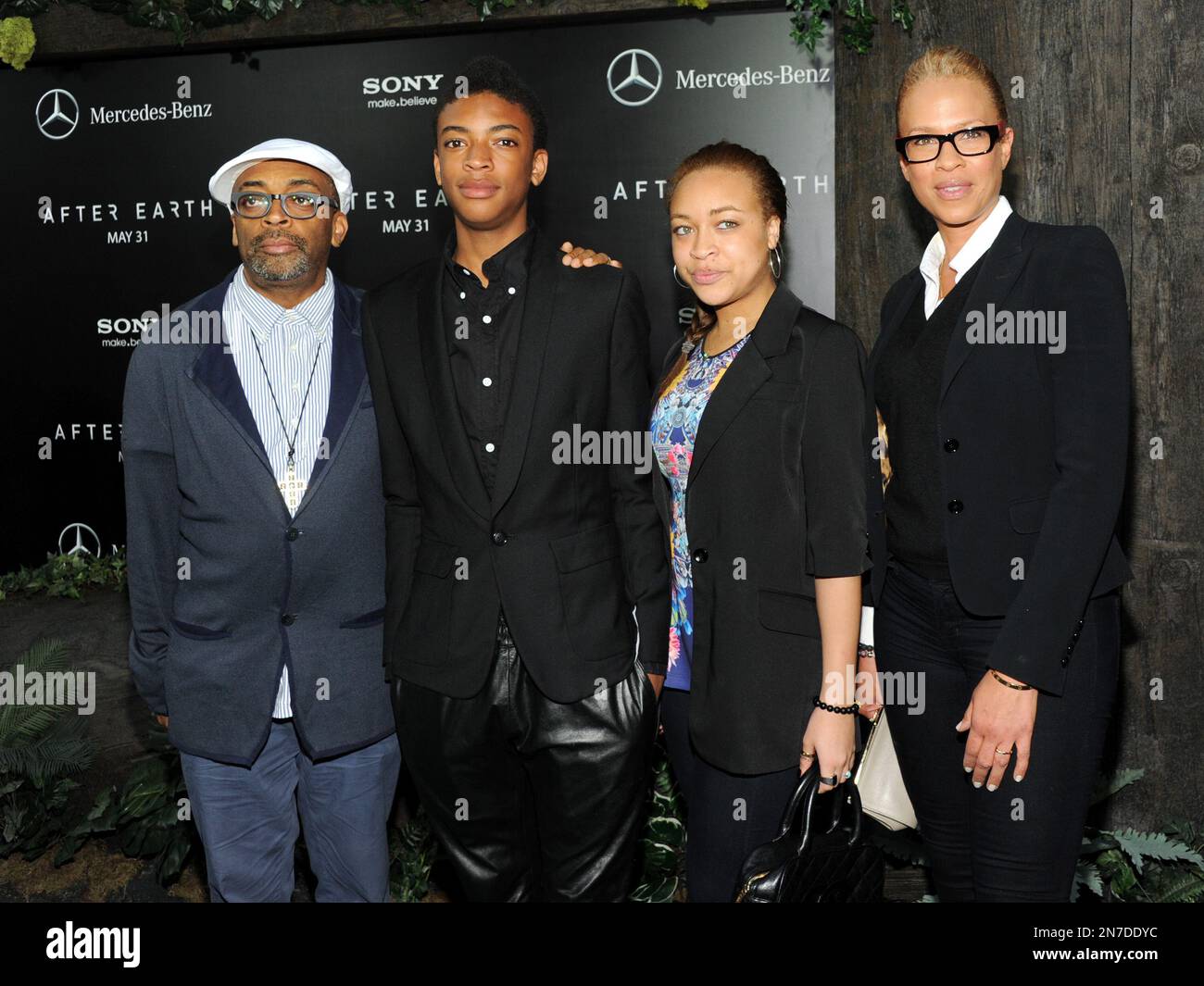 Director Spike Lee, left, poses with his family, from left, Jackson Lee ...