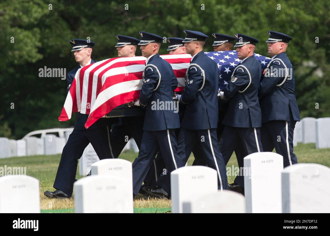 An Air Force honor guard carries the casket containing the remains of retired Air Force Col ...