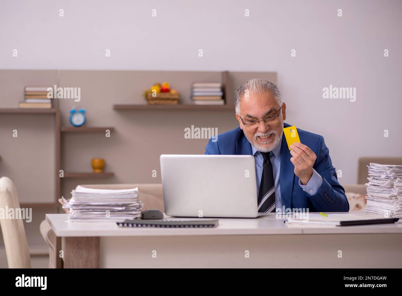 Old boss working from home during pandemic Stock Photo - Alamy
