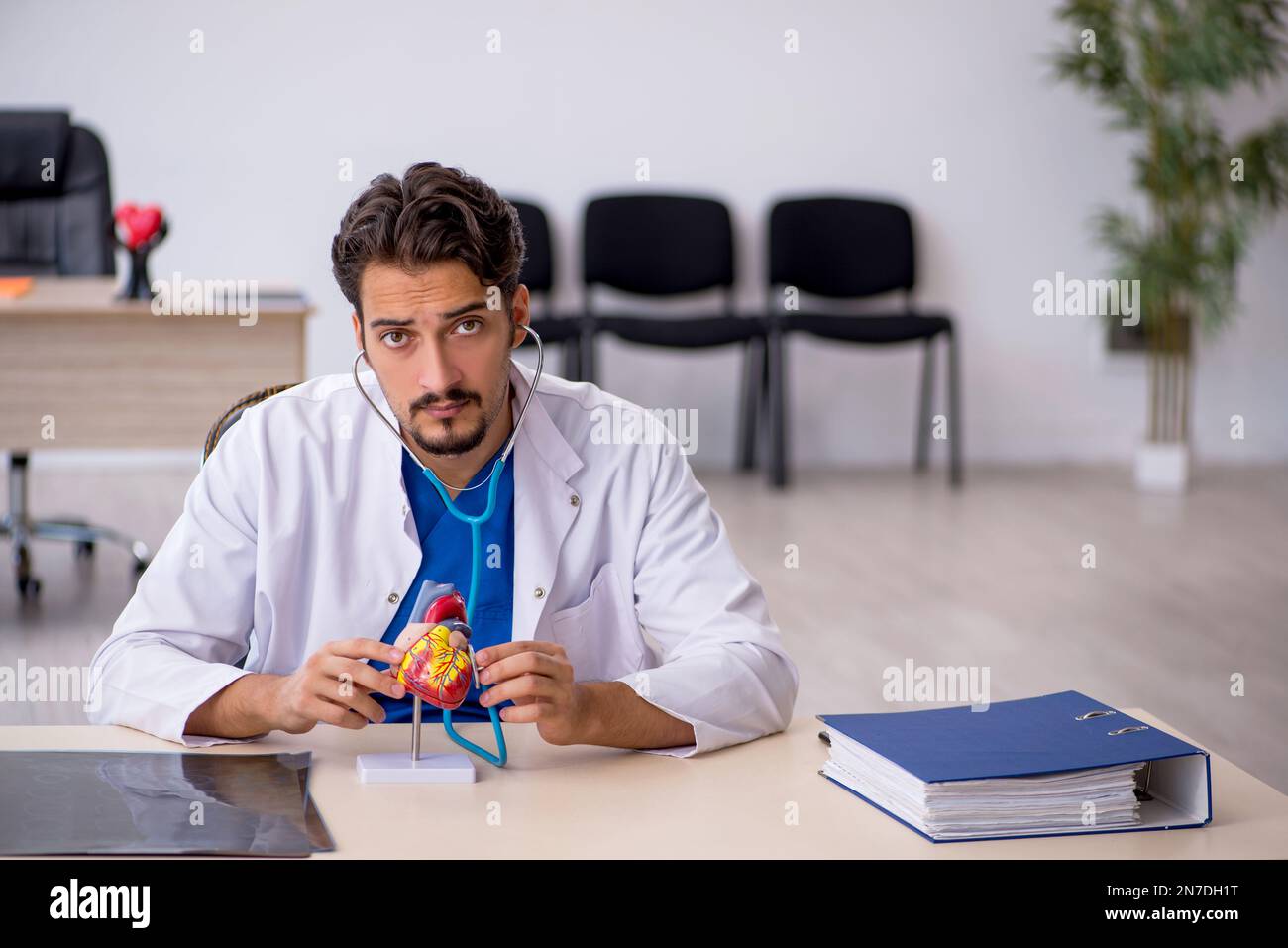 Young doctor cardiologist working at the hospital Stock Photo - Alamy