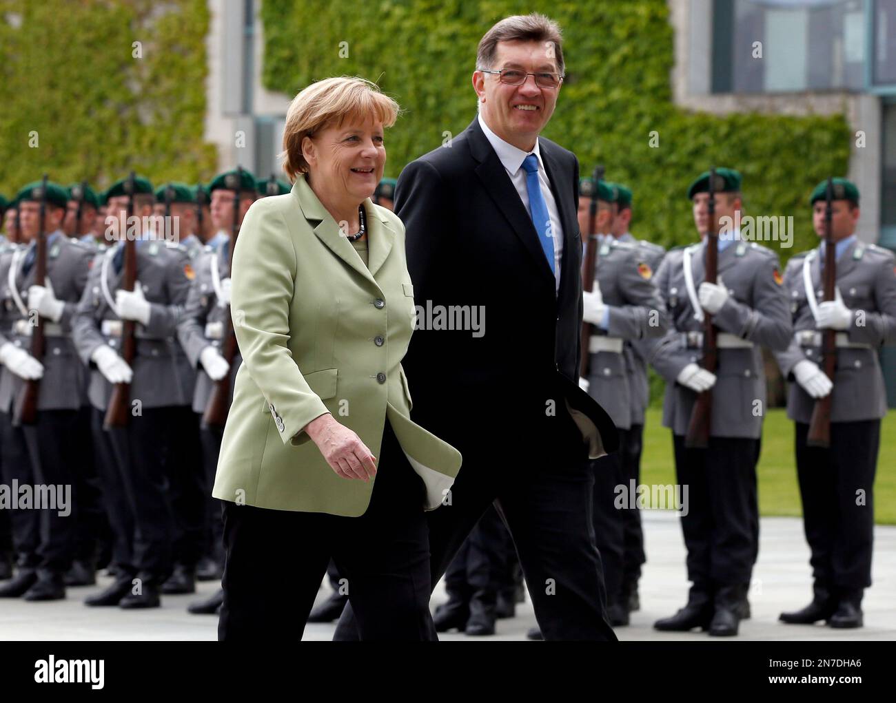 German Chancellor Angela Merkel, left, welcomes the Prime Minister of ...
